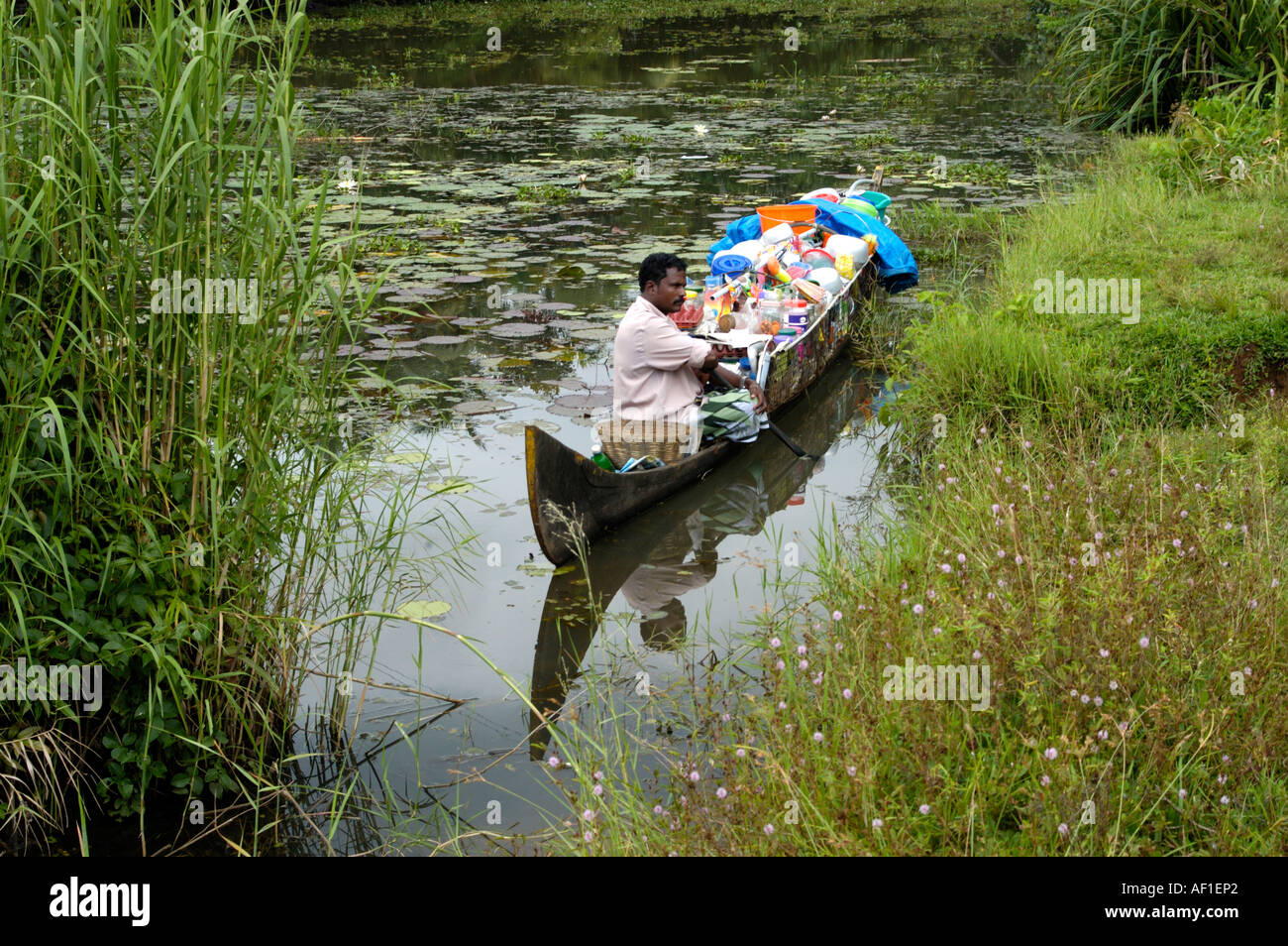 LOCAL SALESMAN IN COUNTRY BOAT, KUTTANAD, ALAPPUZHA Stock Photo - Alamy