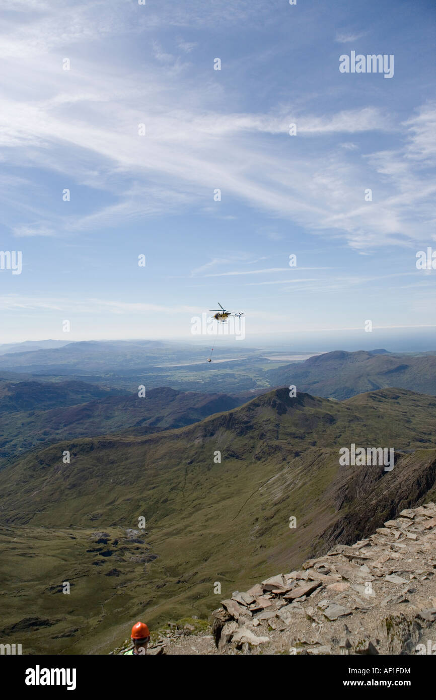 Helicopter flying material to build the new cafe on the top of Snowdon ...