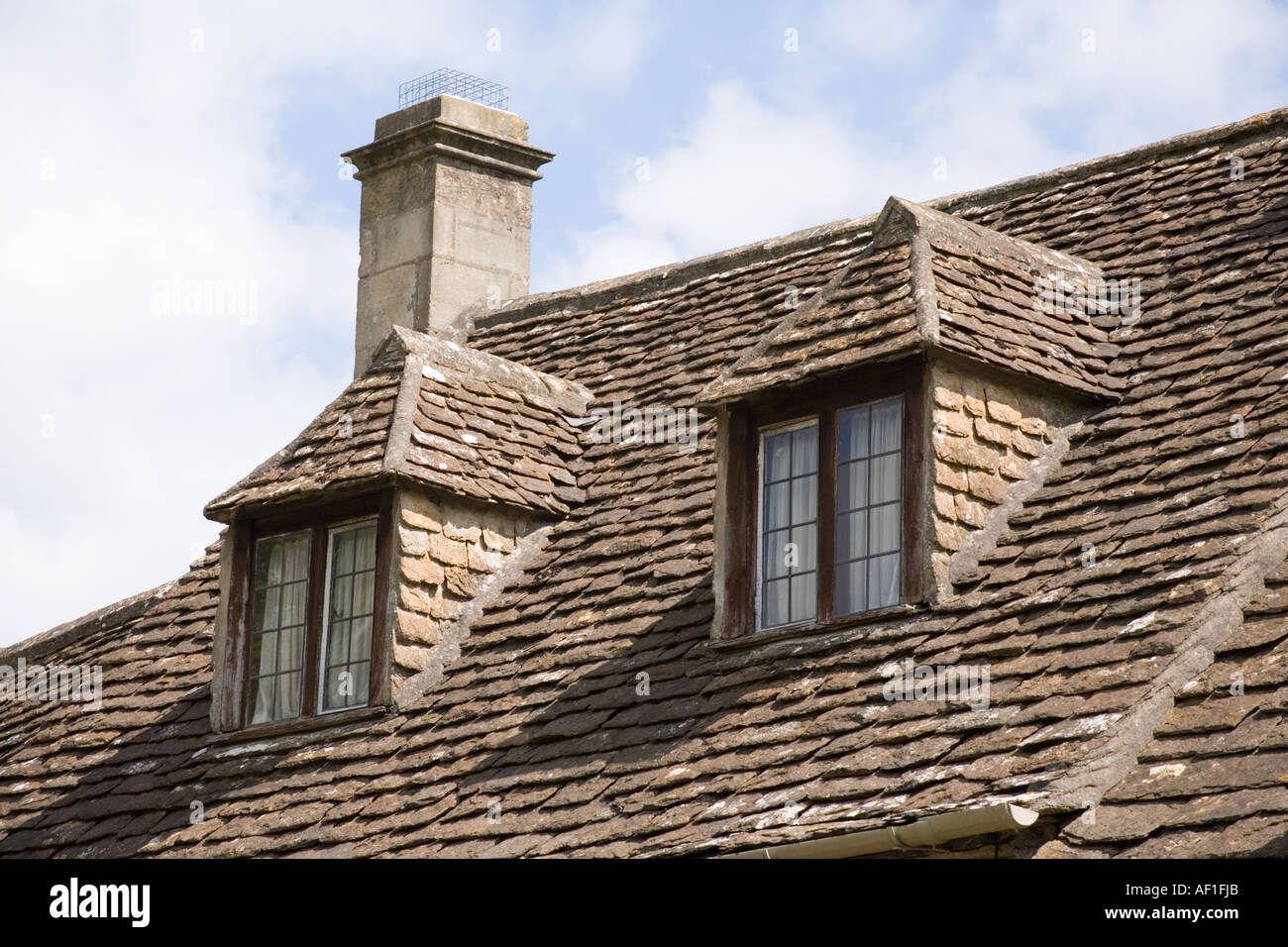 Dormer windows in a Cotswold stone roof on a cottage at Castle Combe ...