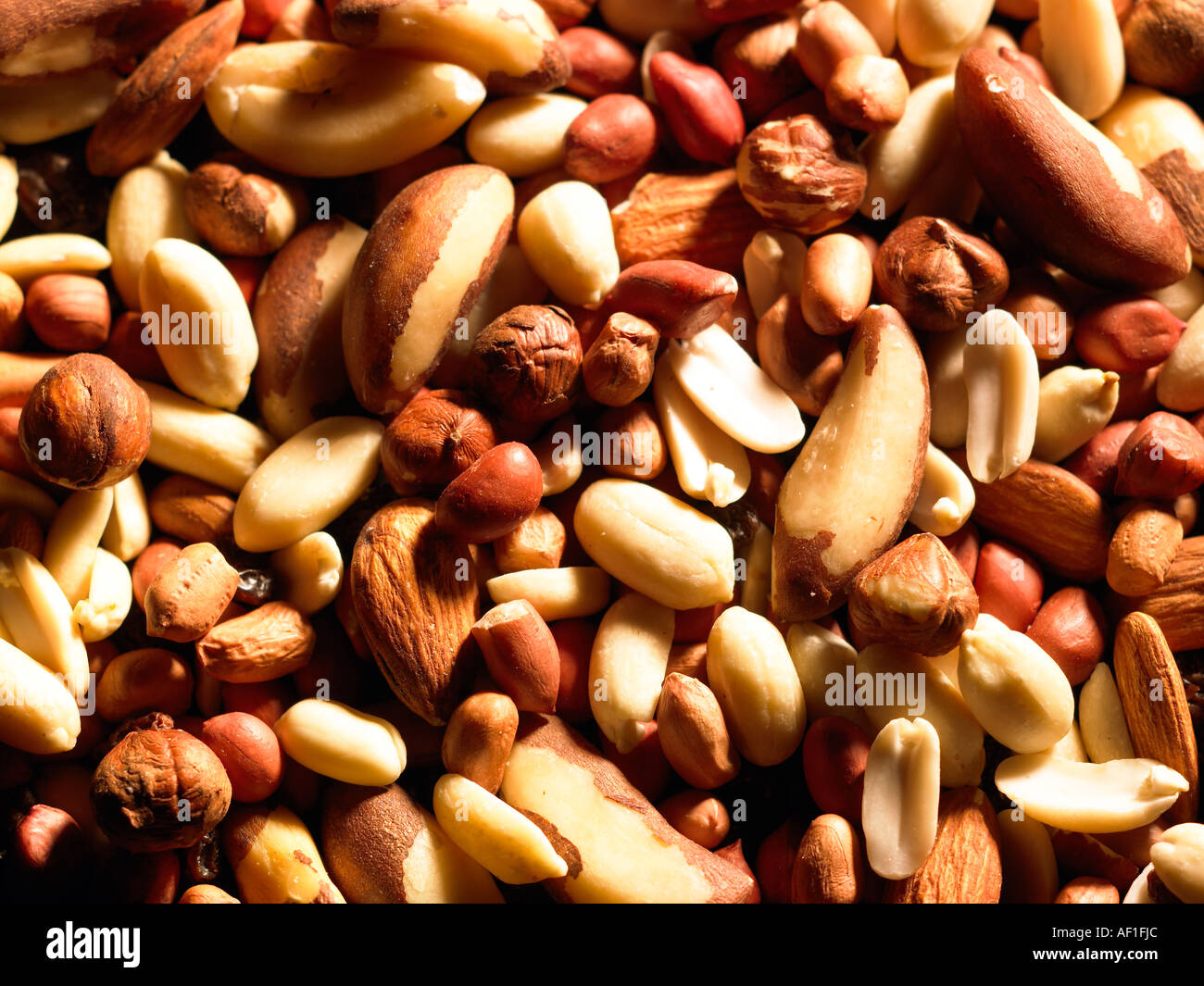 Landscape shot of various nuts including peanuts brazil nuts hazelnuts ...