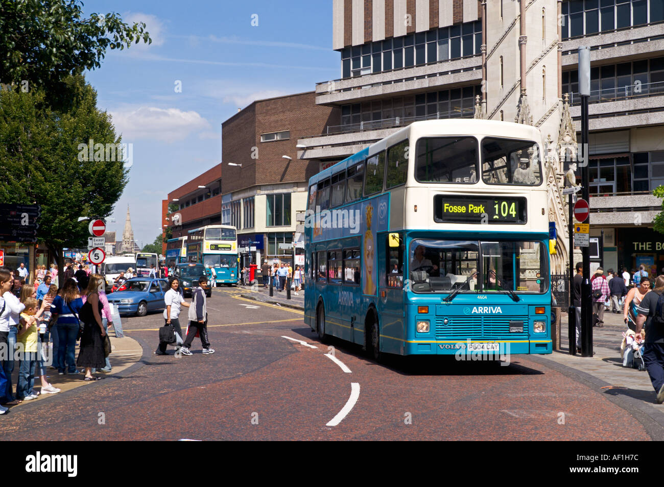 Buses and shoppers in the city centre Leicester Leicestershire England ...