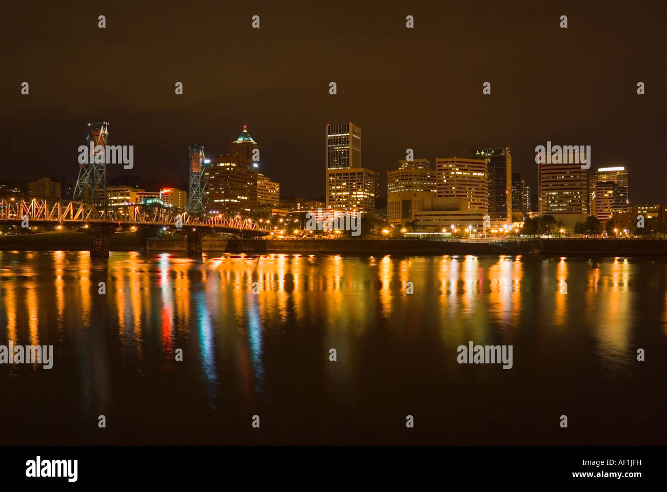 Portland skyline at night reflected in the Willamette River Portland ...