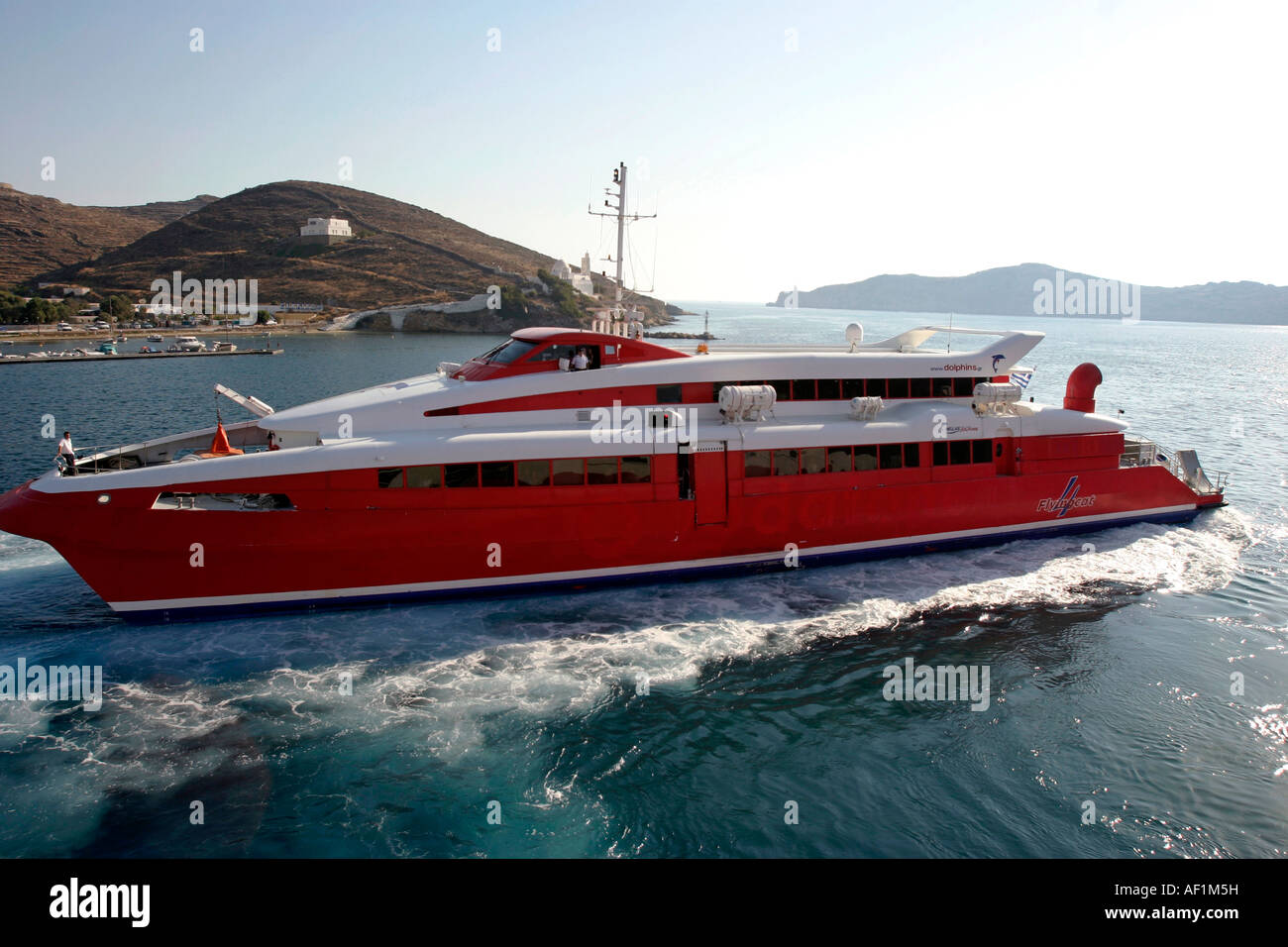 europe greece cyclades islands ios a red fast cat ferry arriving in the ...
