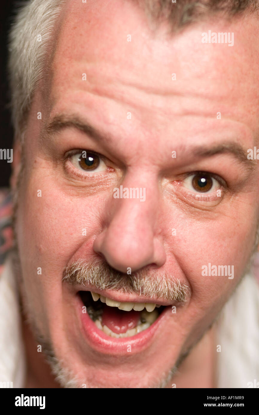 bearded white man pulling a face Stock Photo - Alamy