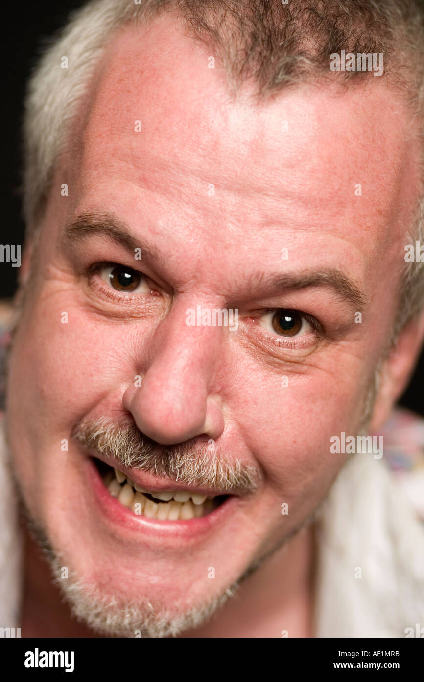 bearded white man pulling a face Stock Photo - Alamy