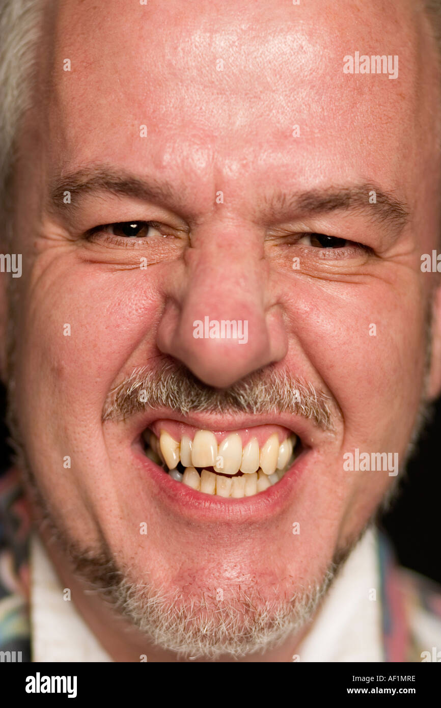 bearded white man pulling a face Stock Photo - Alamy