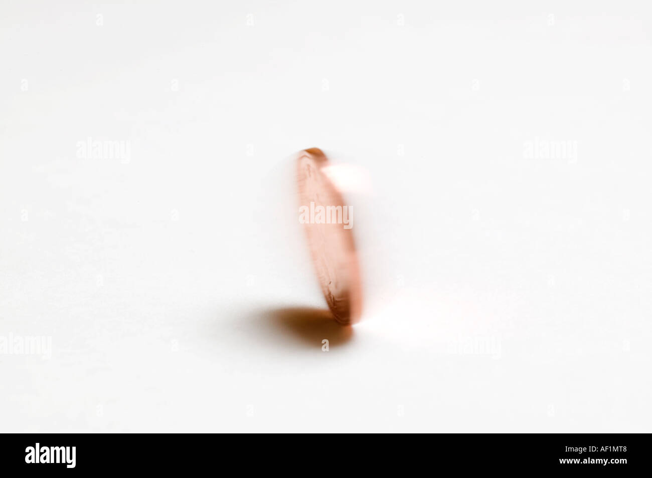Coin spinning on white background hi-res stock photography and images ...