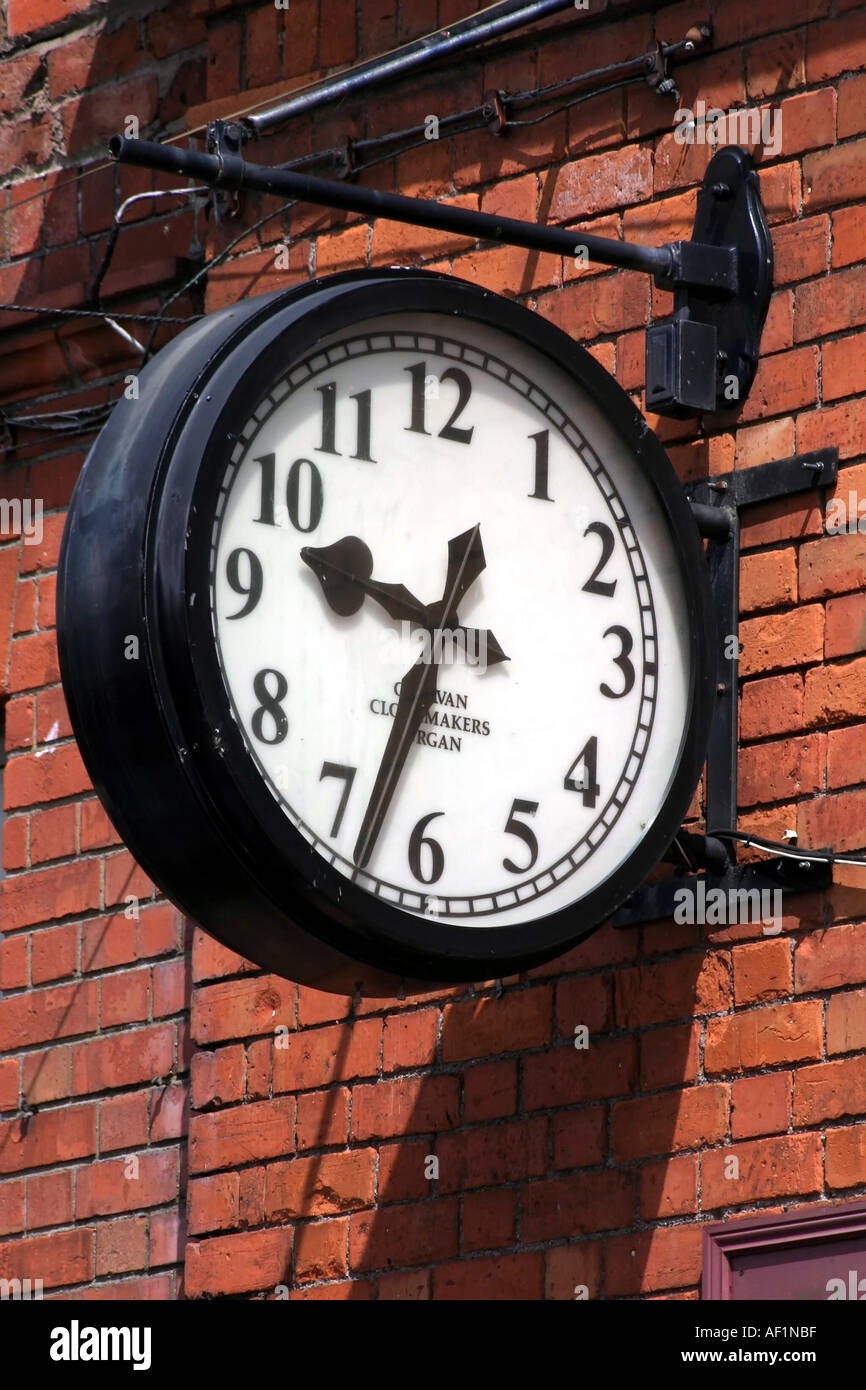clock on red brick wall Stock Photo - Alamy