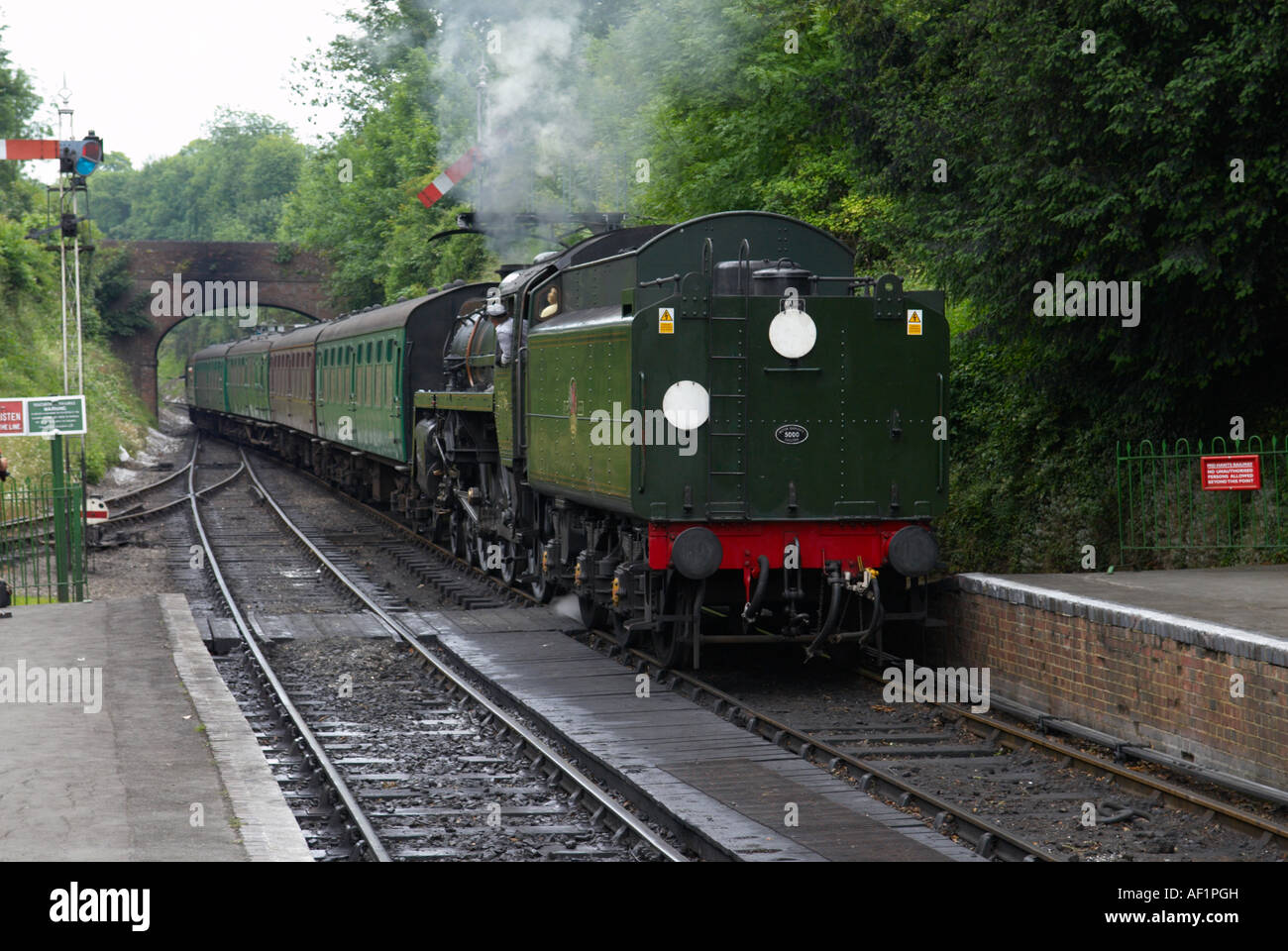 Steam train pushing carriages on the Watercress Line Hampshire UK Stock ...