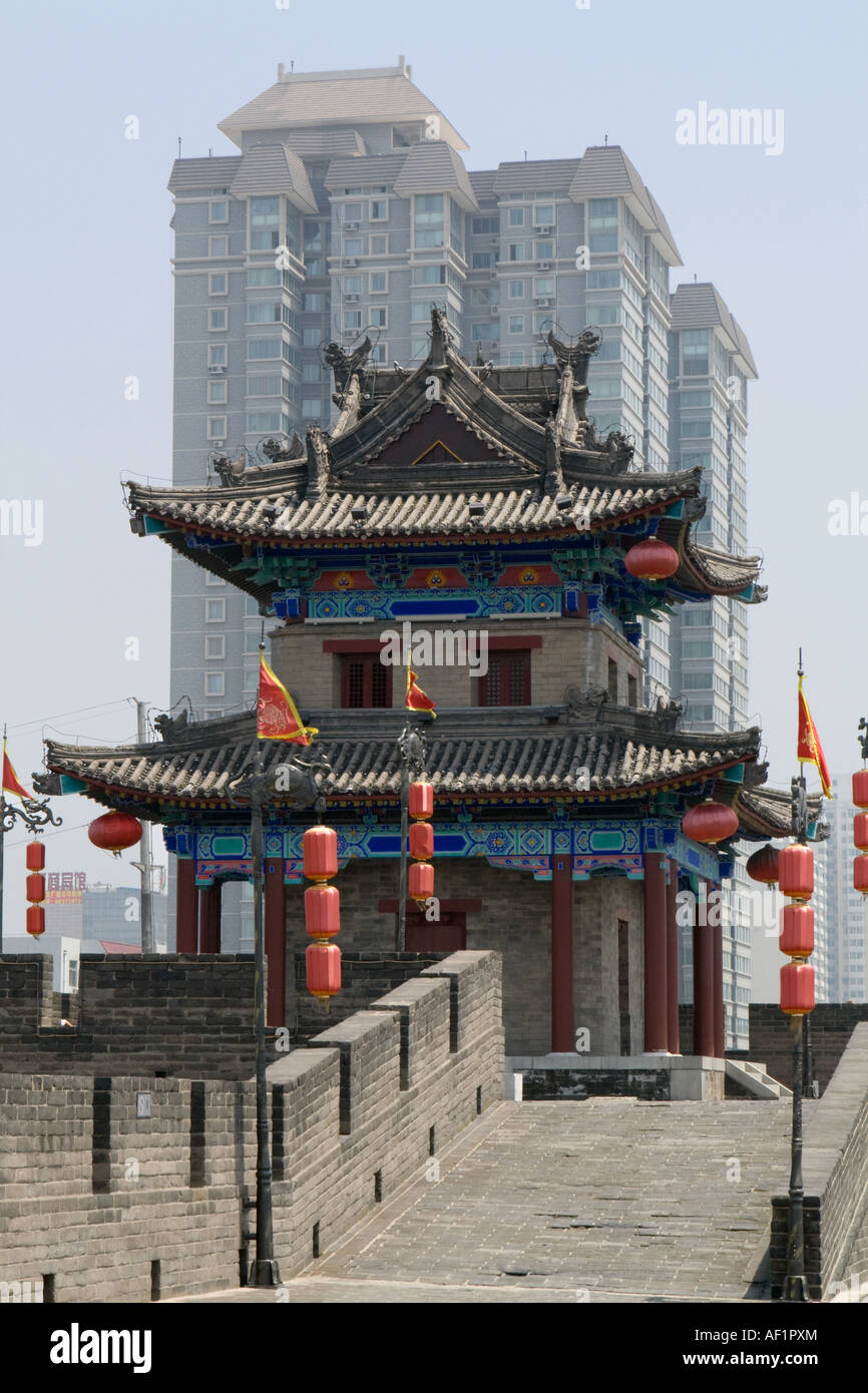 Traditional Chinese pagoda building contrasted with modern high rise ...