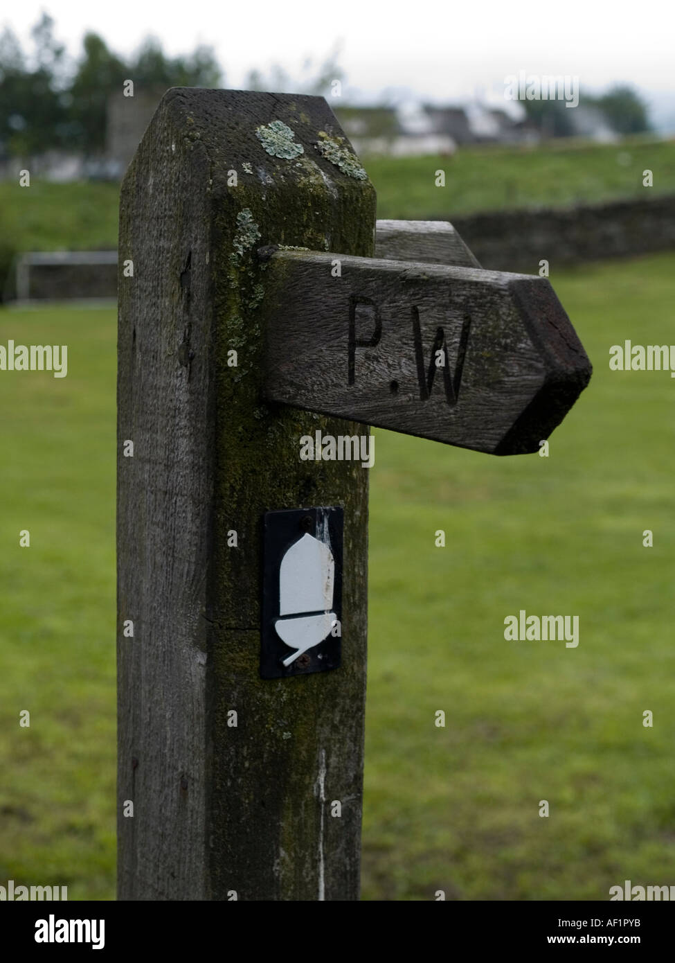 Finger post showing "PW" a sign for the Pennine Way long-distance walk ...