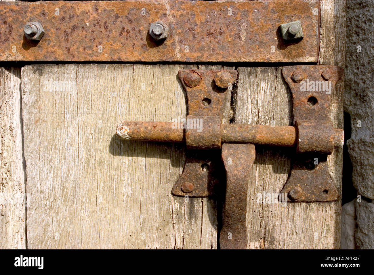 Very old metal lock on a wooden door Stock Photo - Alamy