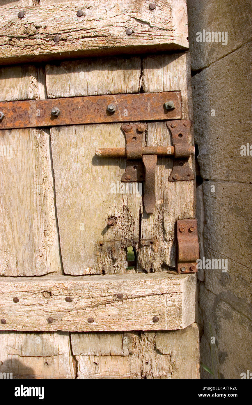 Very old metal lock on a wooden door Stock Photo - Alamy