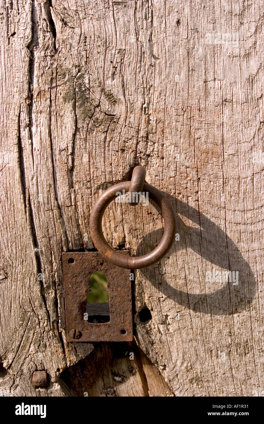 Very old metal lock on a wooden door Stock Photo - Alamy
