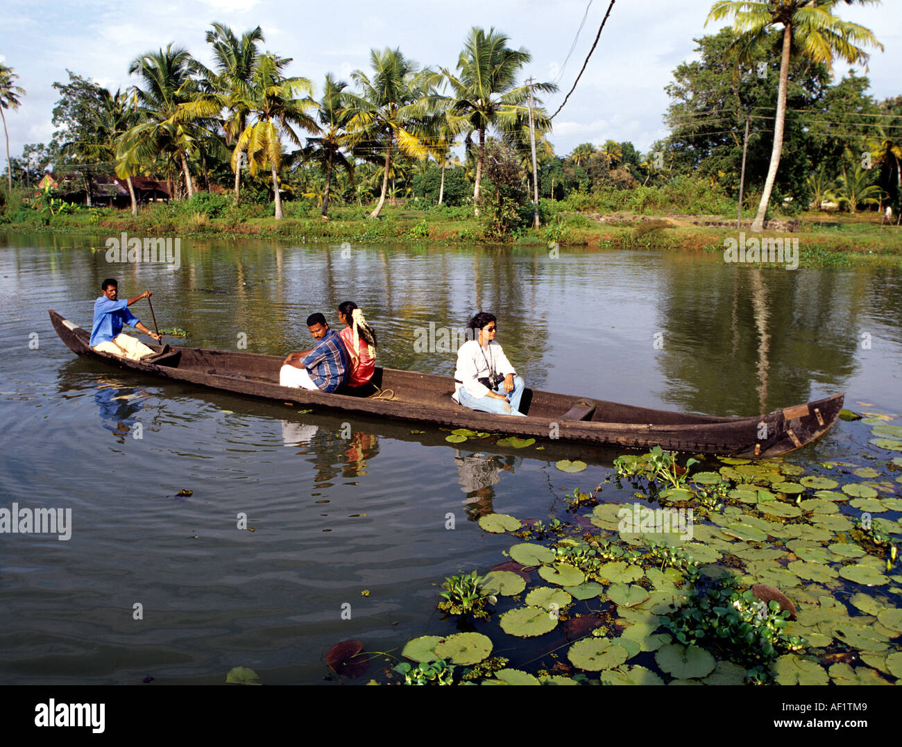 CROSSING THE BACKWATERS IN A COUNTRY BOAT KUTTANAD ALAPPUZHA Stock ...