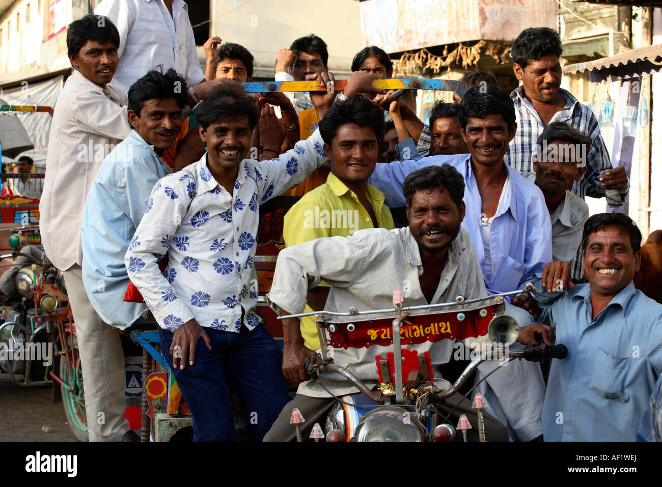 Group of Indian male passengers packed on full chakda - motorbike ...
