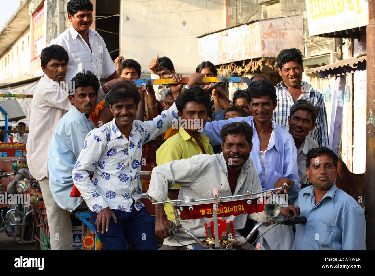 Indian male passengers packed on to full chakda - motorbike rickshaw ...