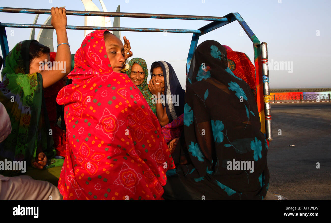Locals going to work in rear of chakda - motorbike rickshaw taxi, Diu ...