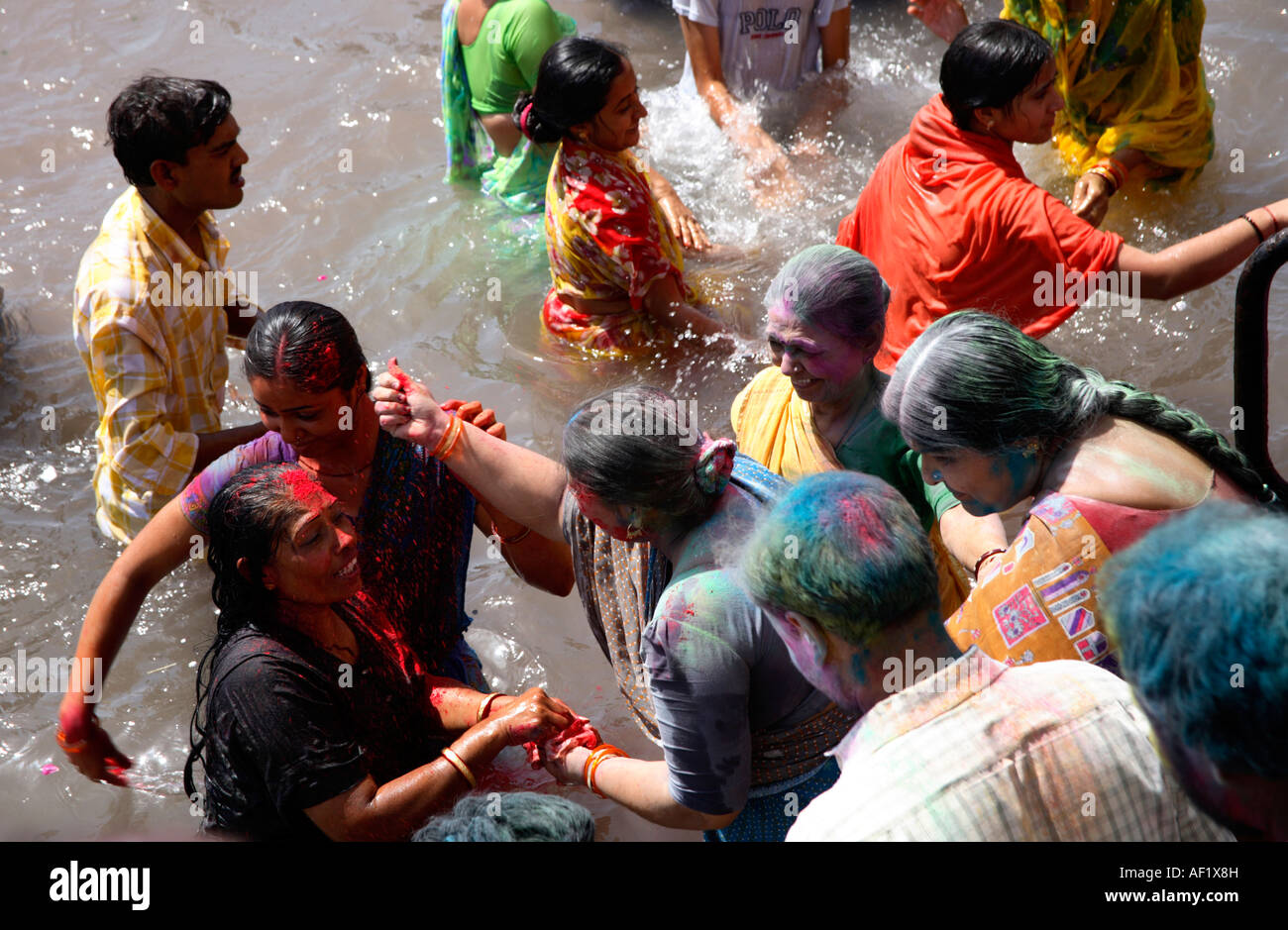 Indian families celebrating Holi Spring Festival at Gomati Bathing Tank ...