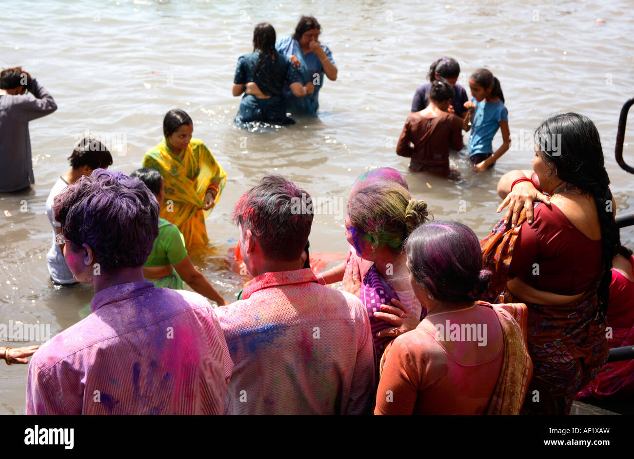 Indian families celebrating Holi Spring Festival at Gomati Bathing Ghat ...