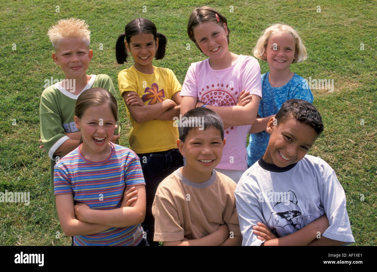 Group of seven children together in parc Stock Photo - Alamy