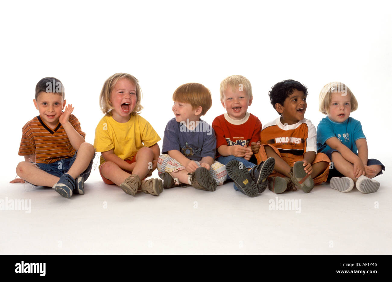 Group of six kids in a row in the studio Stock Photo - Alamy