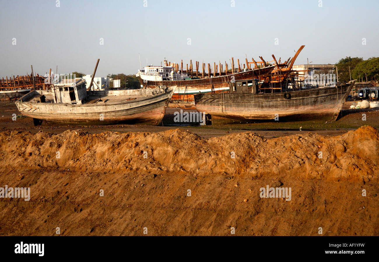Small timber boats being built on dry ground at wooden shipbuilding ...