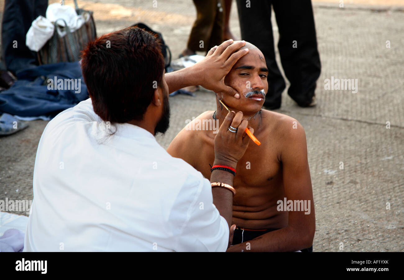 Indian male having mundan - head shaved as mark of respect during ...