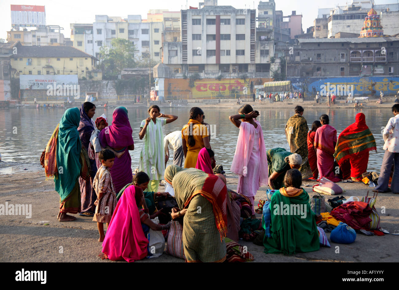 Indian females performing morning daily ablutions at Ramkund bathing ...