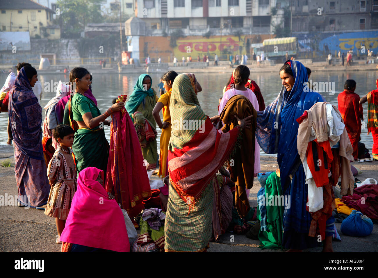 Indian females performing morning daily ablutions at Ramkund bathing ...