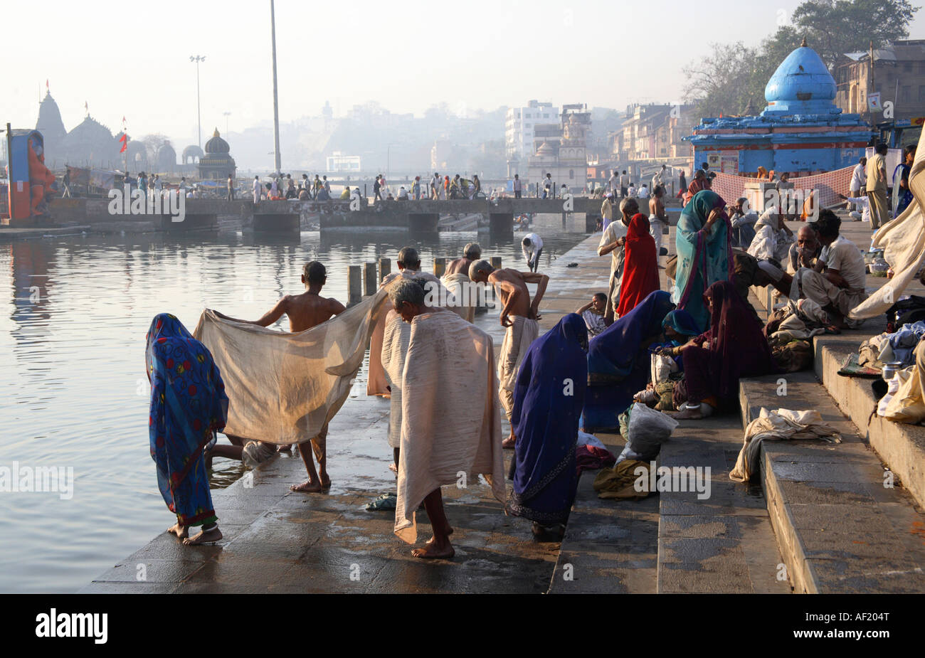 Indian families performing morning daily ablutions at Ramkund bathing ...
