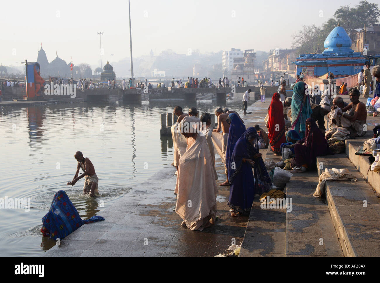 Indian families performing morning daily ablutions at Ramkund bathing ...