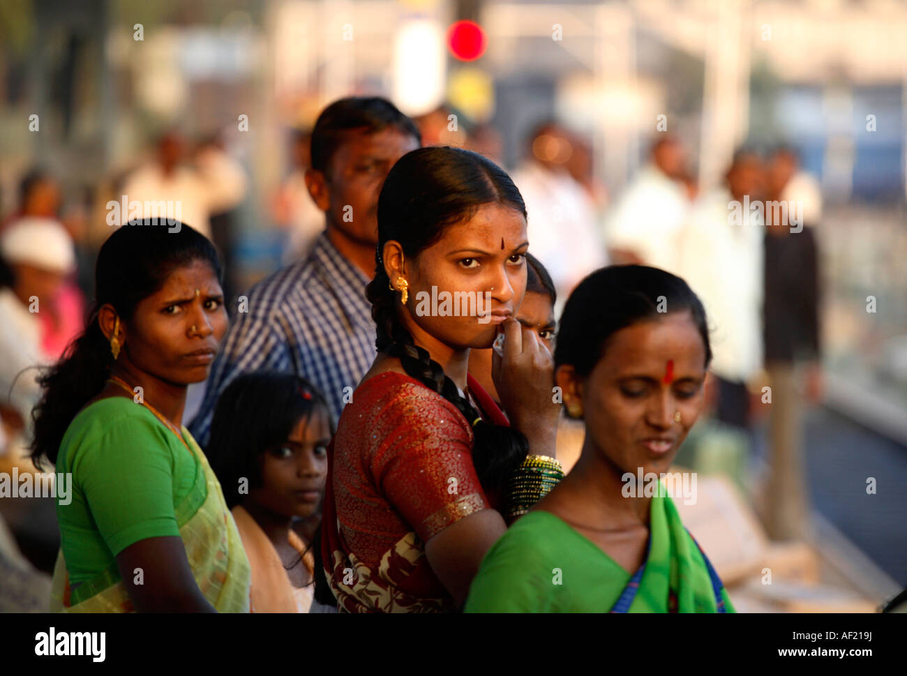 Indian females waiting on platform at railway station, Pune, India ...