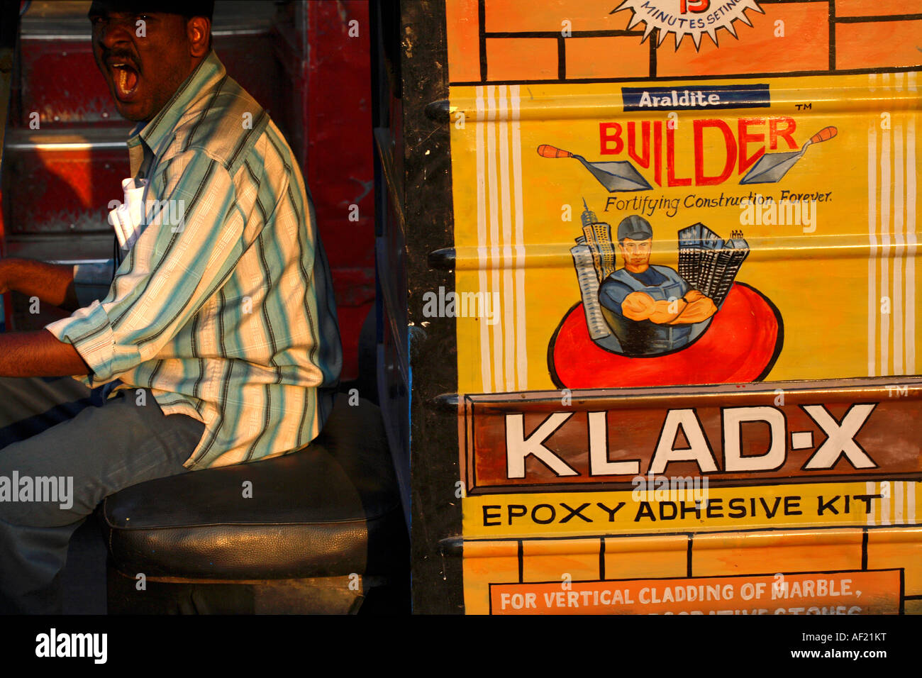Yawning Indian auto rickshaw driver in traffic, Pune, India Stock Photo ...