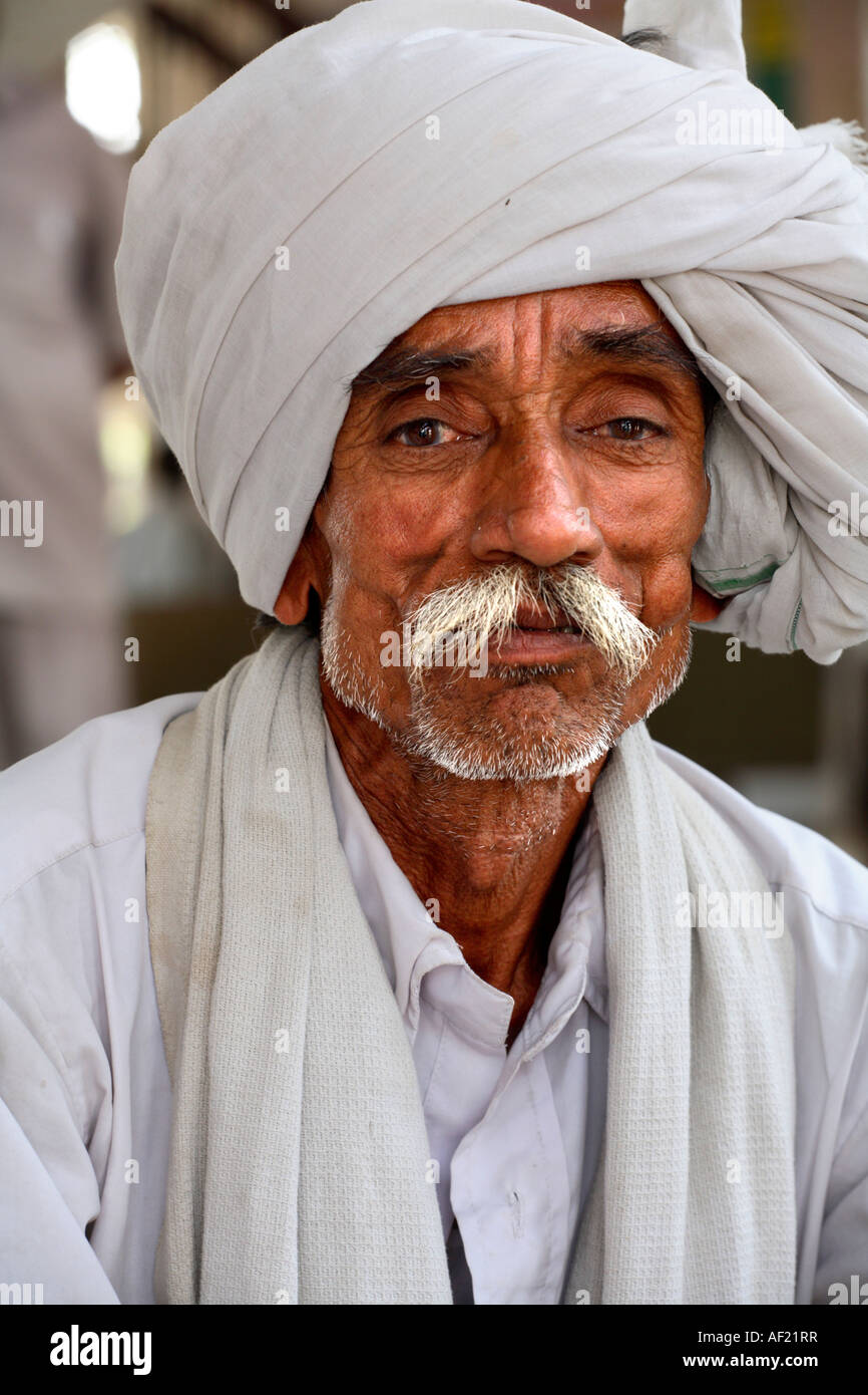 Indian male from Rabari tribe waiting at Diu bus-stand, Gujarat, India ...