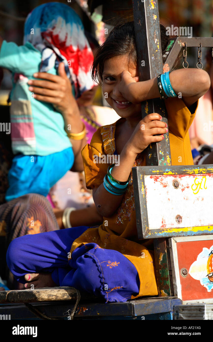 Shy Indian Child in the rear of chakda - motorbike taxi, Una, Gujarat ...