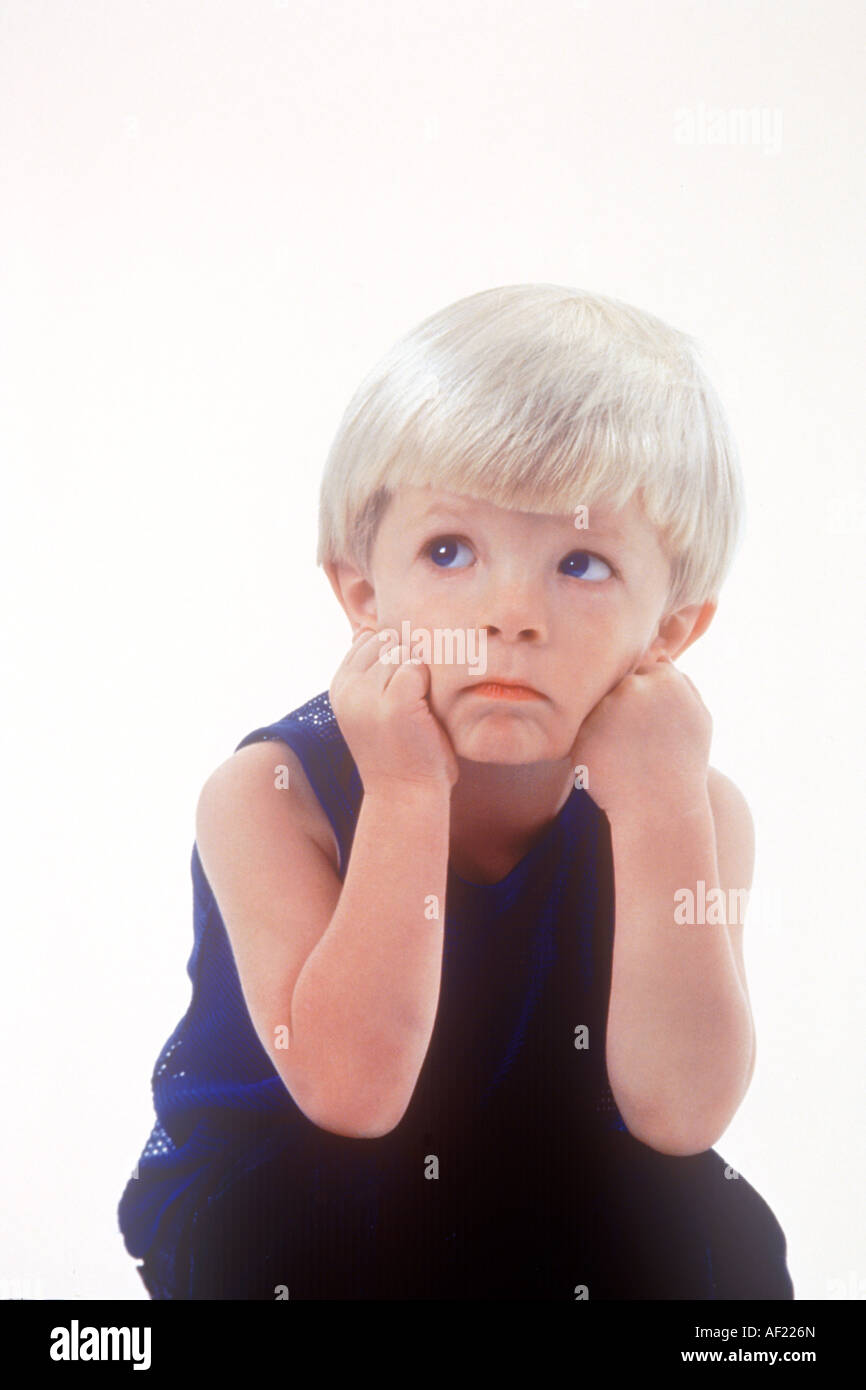 Boy scowling hi-res stock photography and images - Alamy