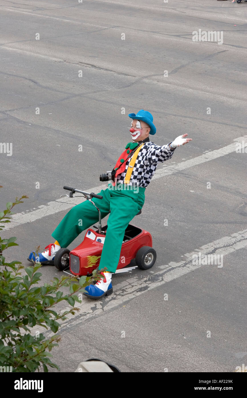 Clown entertaining curbside crowd at street festival parade Stock Photo ...