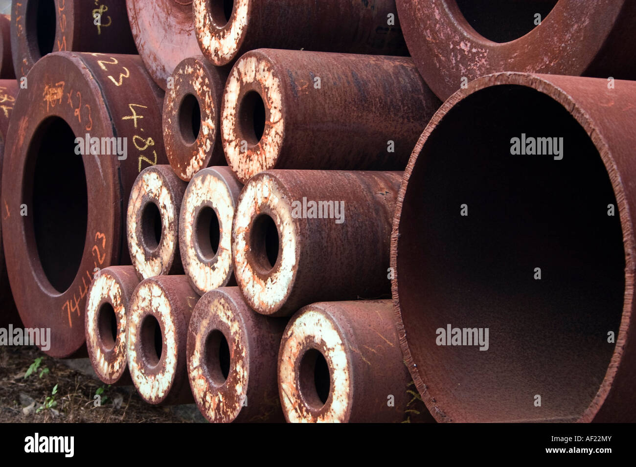 A stack of rusty steel pipes await collection Stock Photo - Alamy