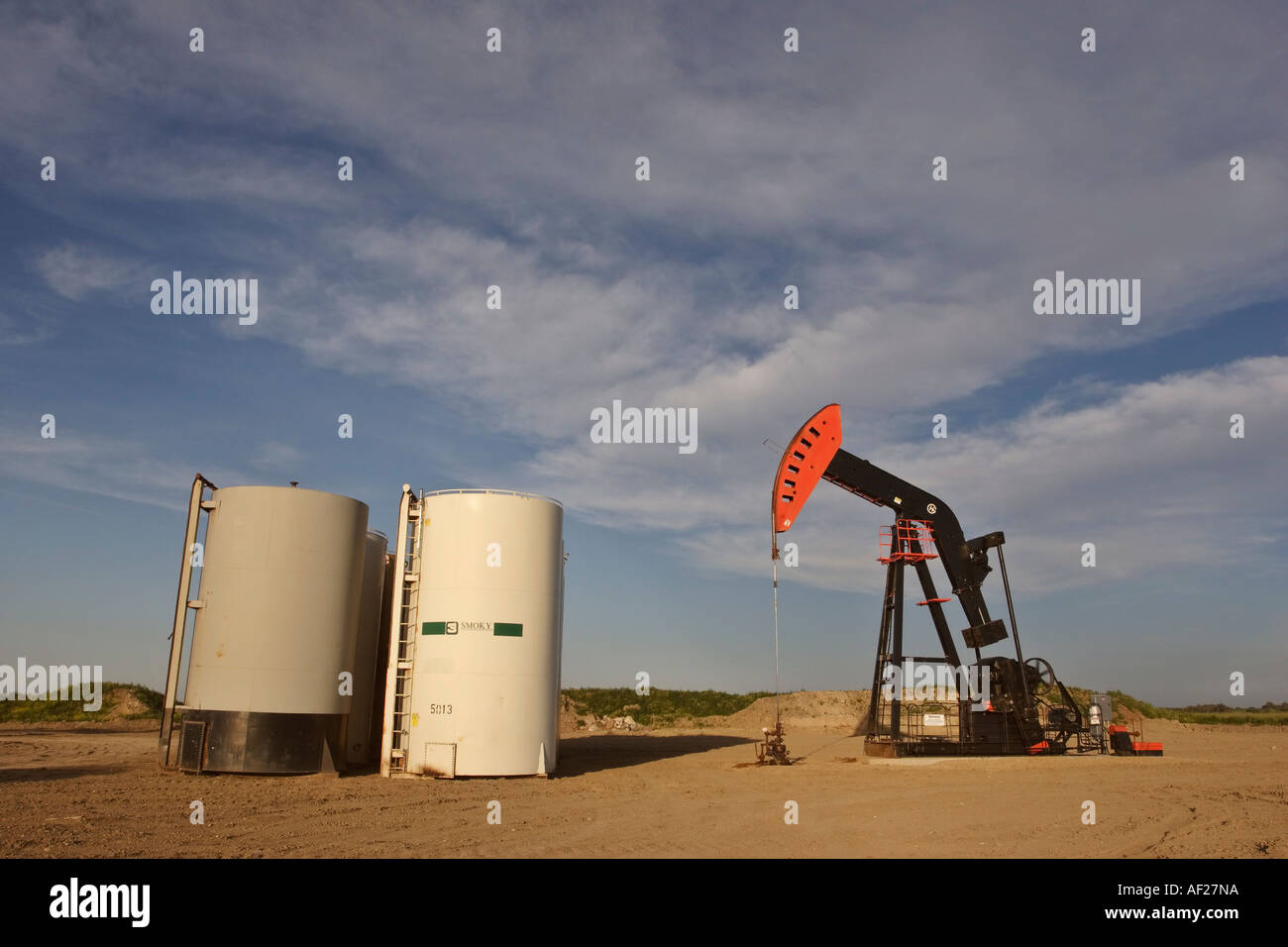 Mission Oil pump jack and tanks in the Viewfield Oil Field in scenic ...