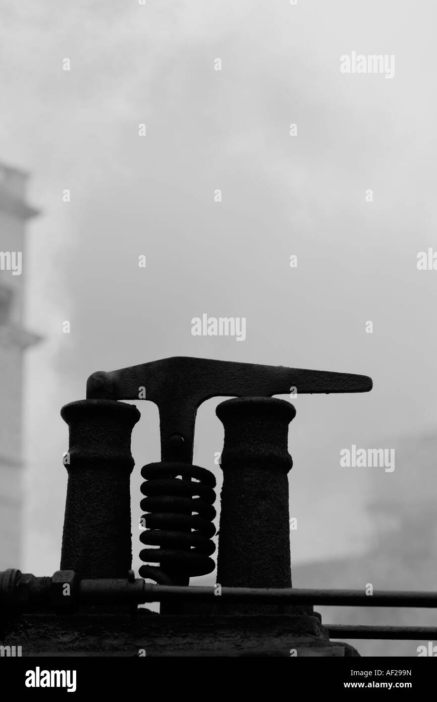 Detail of soot encrusted pressure valve on veteran steam engine Stock ...