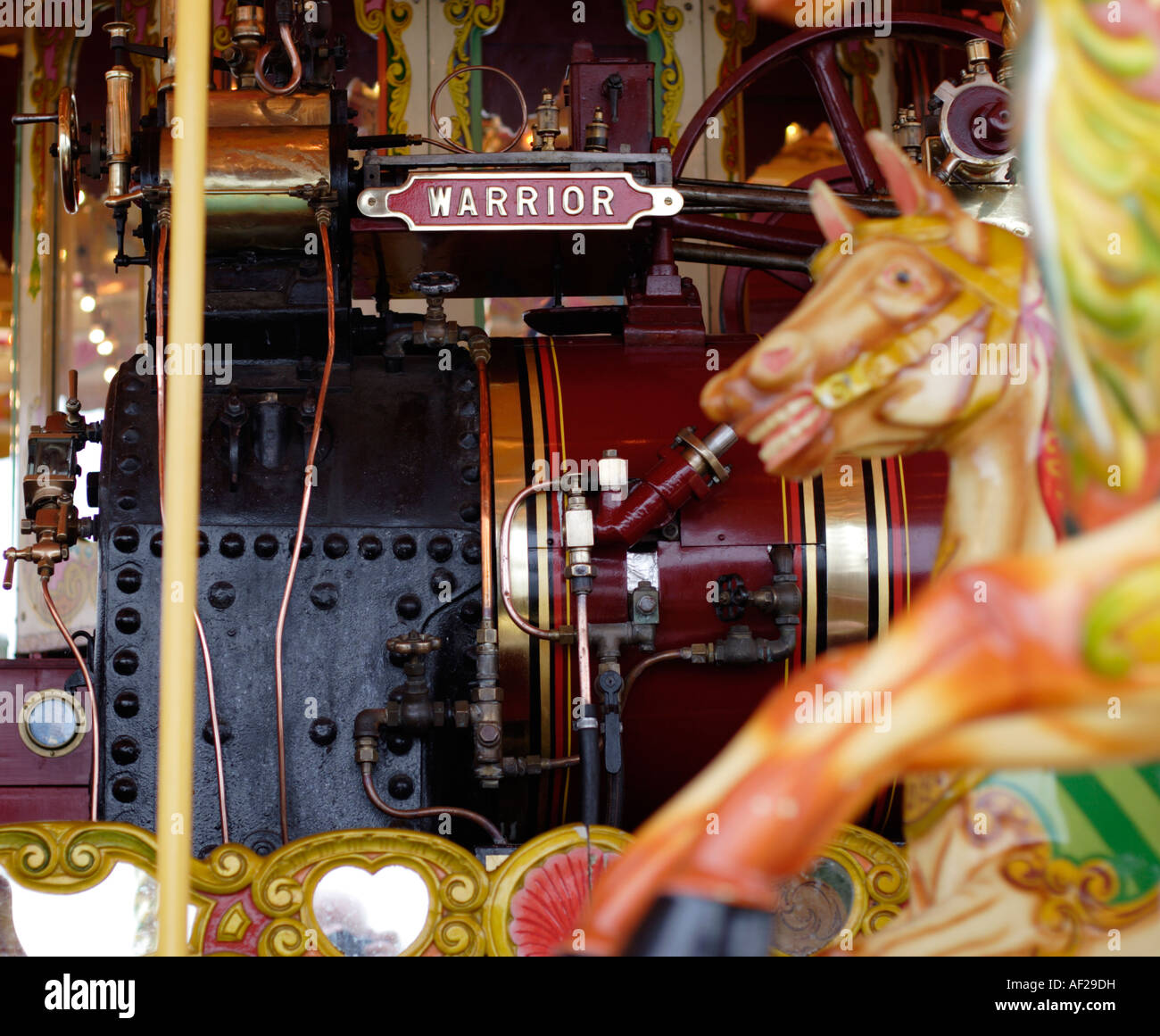 Steam engine named Warrior in the centre of a funfair carousel Stock ...