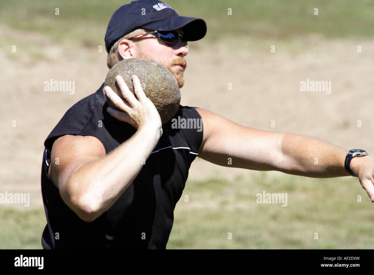 Stone put. Man is throwing Stone.Highland Games. Special Event part of ...