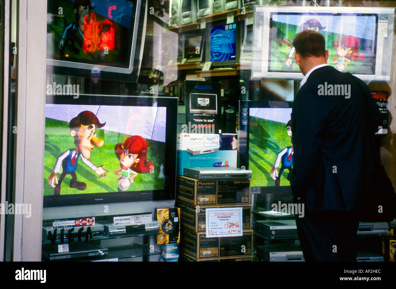 Man window shopping for televisions Stock Photo - Alamy
