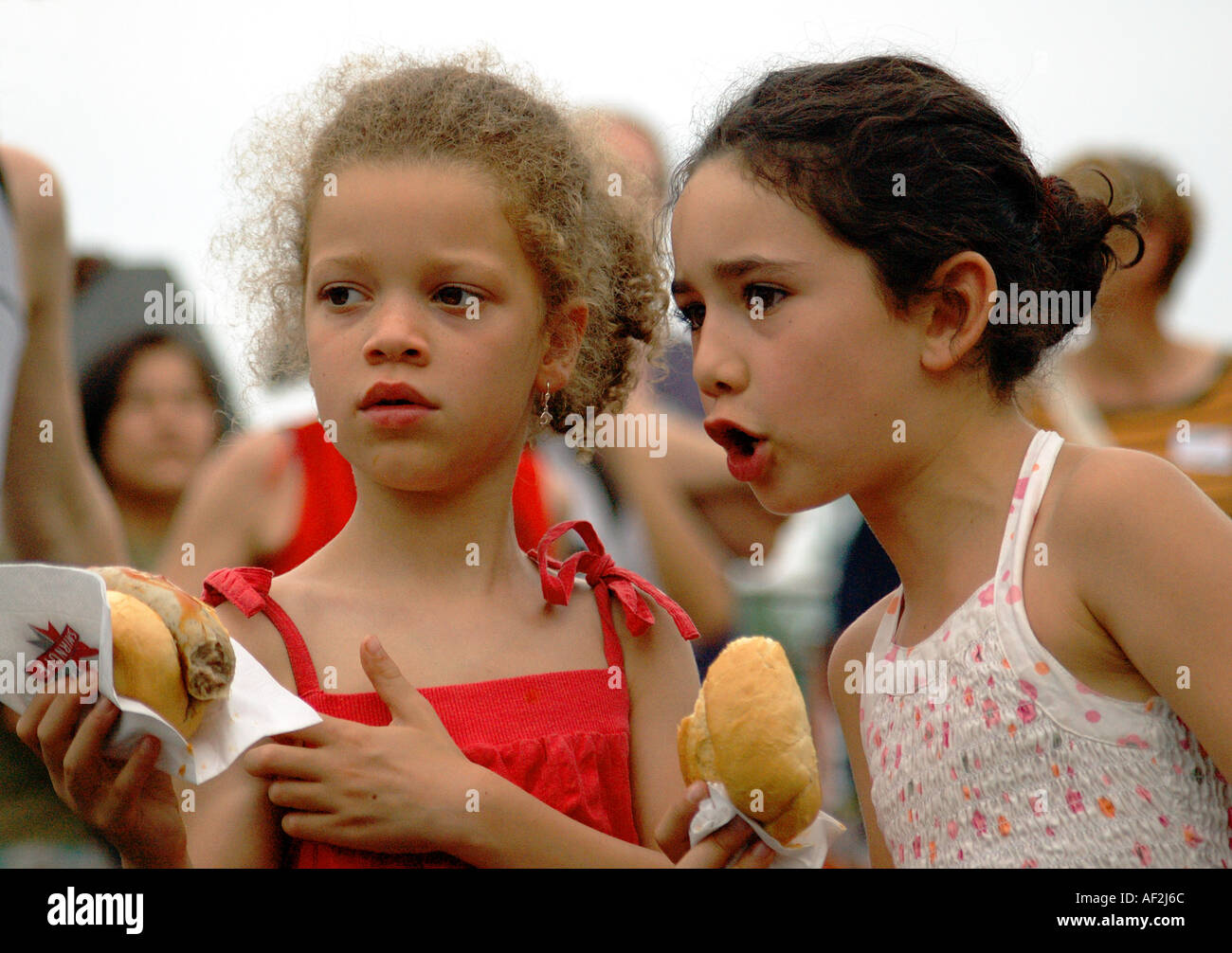 Chummy moment over sausage Stock Photo - Alamy