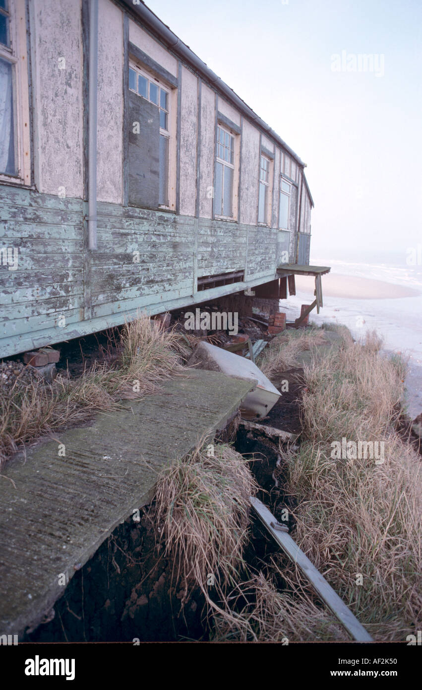 House overhanging cliff due to coastal cliff erosion East Yorkshire UK ...
