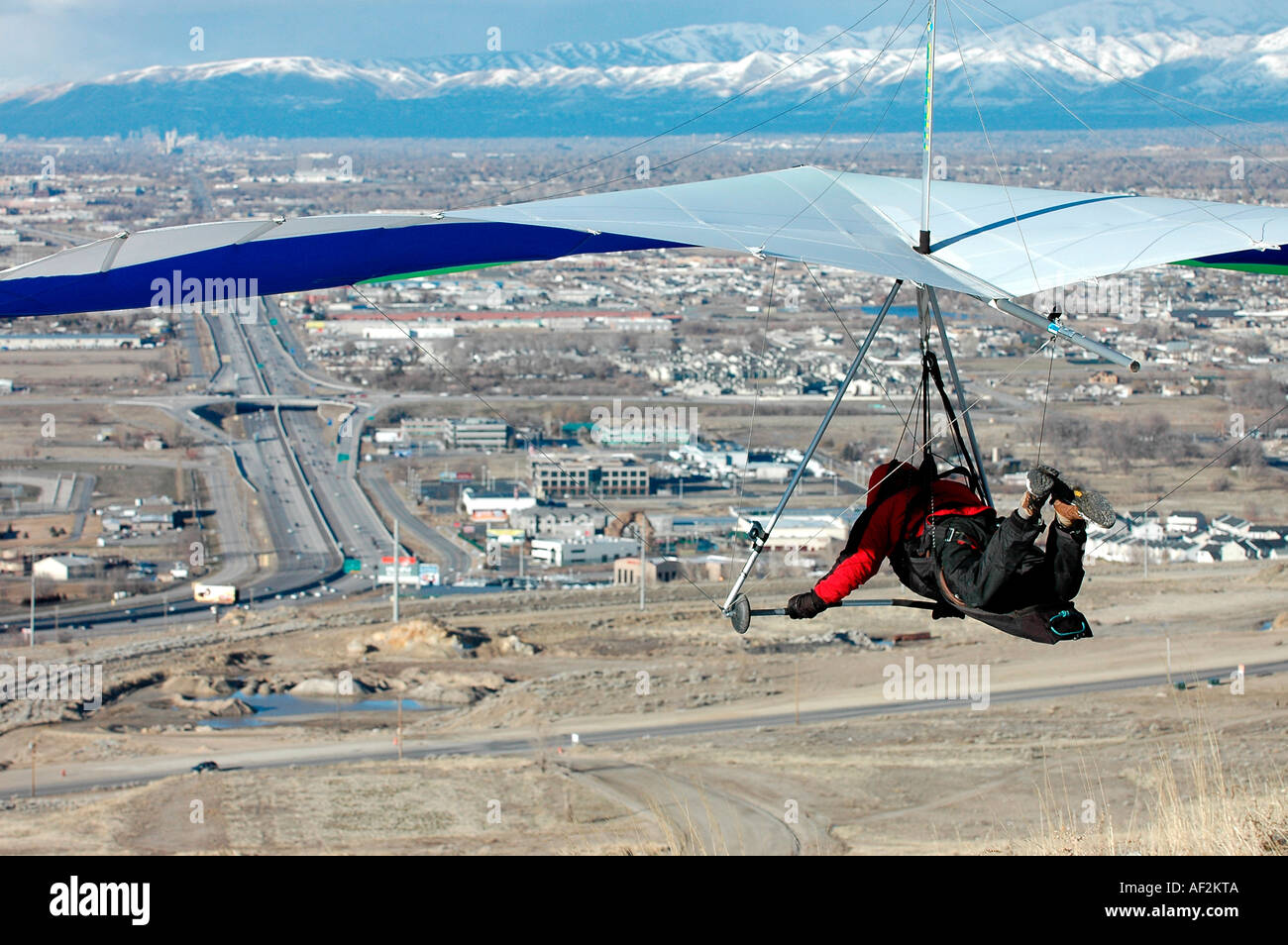 Second in series of hang glider pilot taking off over the Salt Lake ...