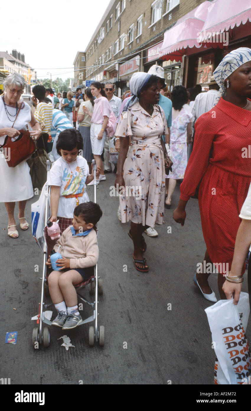 Multicultural crowd of people shoppingin Brixton South london Stock ...