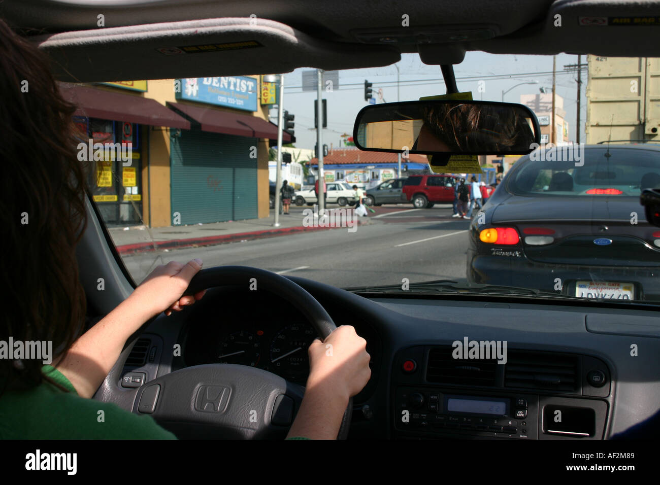 Two hands on the steering wheel while driving Stock Photo - Alamy