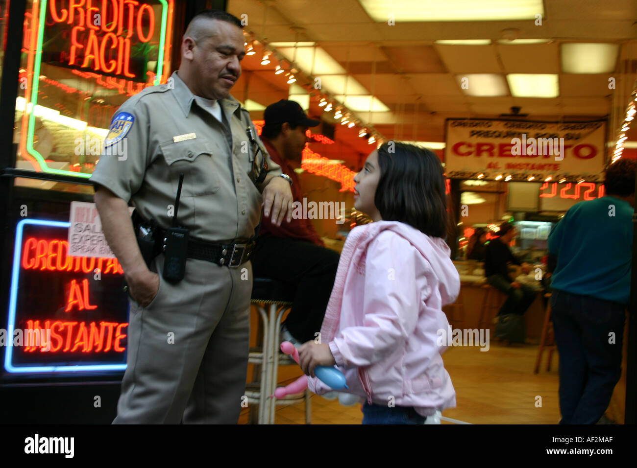 Girl speaking with security guard Stock Photo - Alamy